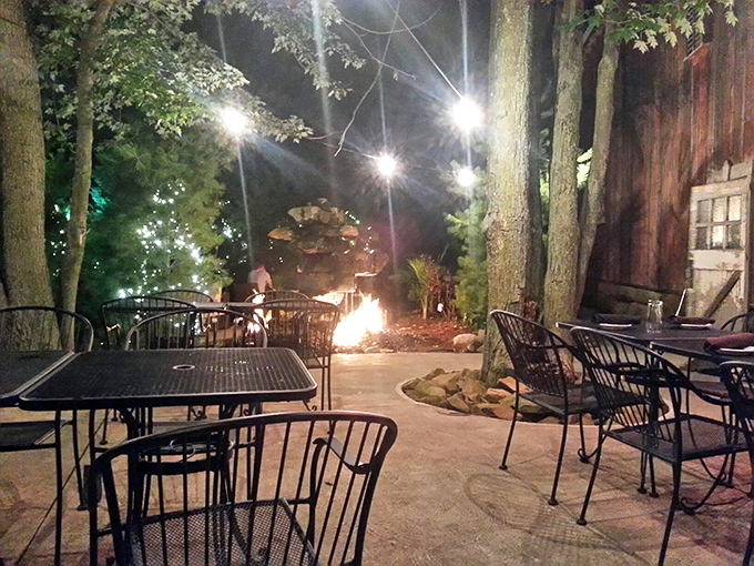 Firelight and starlight create dining magic outdoors. Nature becomes the perfect dinner companion at Strip's enchanting patio space.
