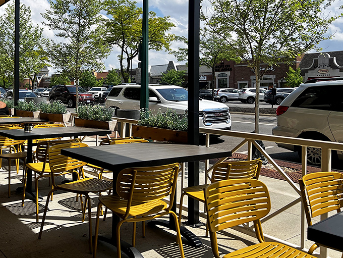 Yellow chairs on the patio practically shouting "Sunshine!" even on cloudy days&mdash;proof that outdoor dining is a state of mind.