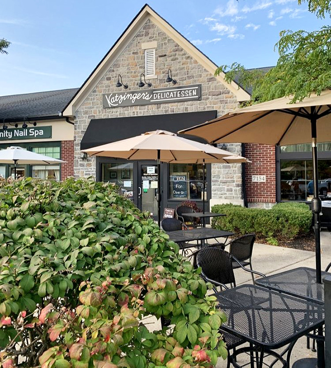 Outdoor tables beckon under blue skies, promising al fresco dining where sandwiches taste even better with a side of sunshine.