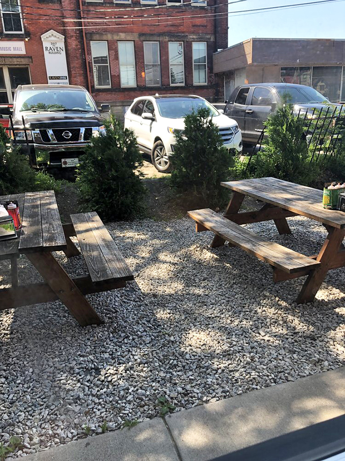 The outdoor seating area offers fresh air to complement your meat sweats, with rustic picnic tables perfect for making new friends over shared barbecue enthusiasm.