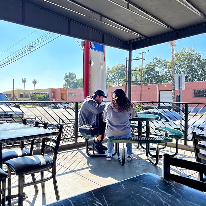 Even the outdoor seating area becomes a romantic spot when carnitas are involved. Love blooms where good food is served.