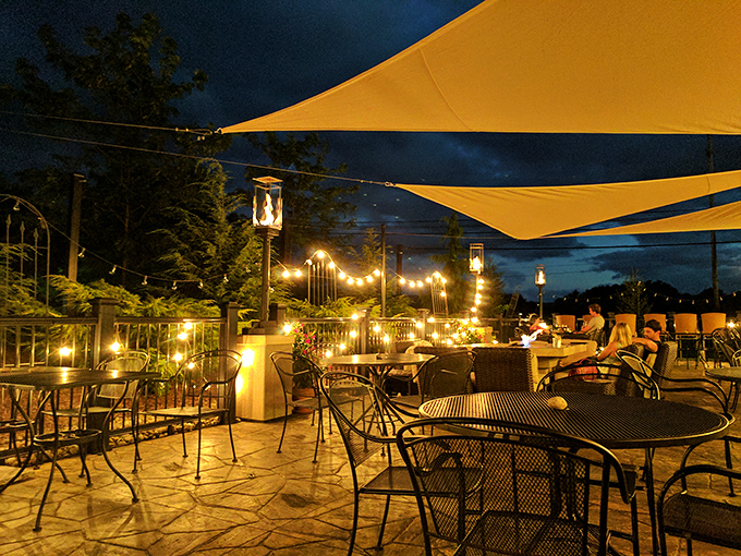 Outdoor dining under the stars with string lights creating magic. The kind of patio that makes you wish summer would never end.