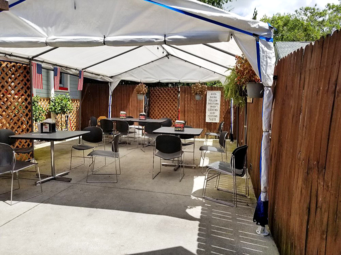 The outdoor seating area offers a change of scenery without changing what matters—straightforward tables where great food takes center stage.