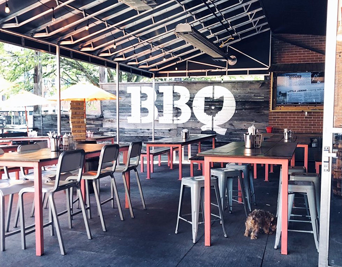 The outdoor patio's "BBQ" wall art isn't just decoration &ndash; it's a beacon calling hungry downtown Columbus wanderers to their smoky salvation.