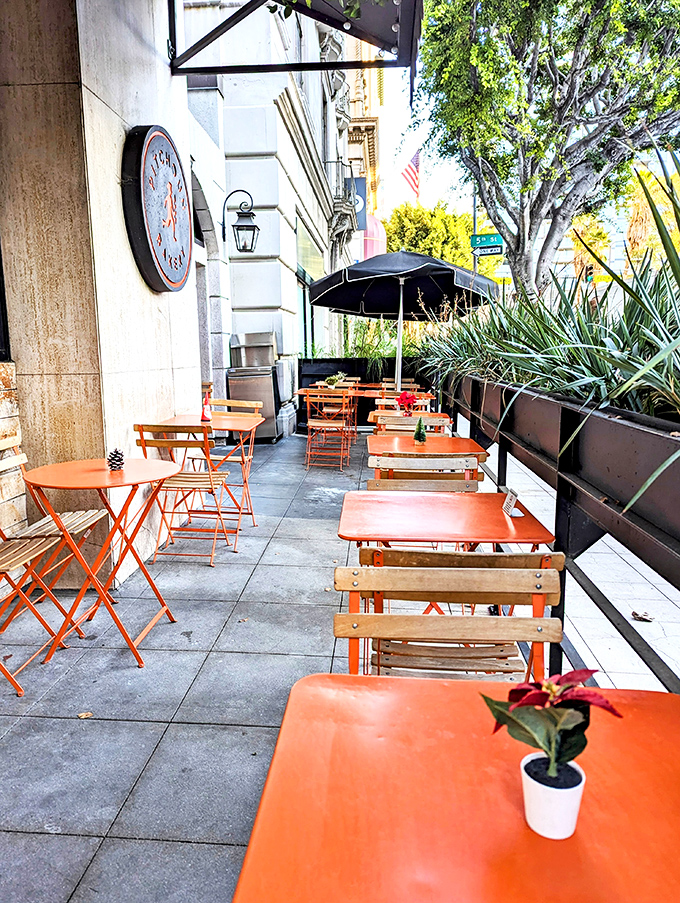 Sidewalk seating that channels the boulevards of Paris, complete with tiny potted plants. Urban dining doesn't get more charming than this.