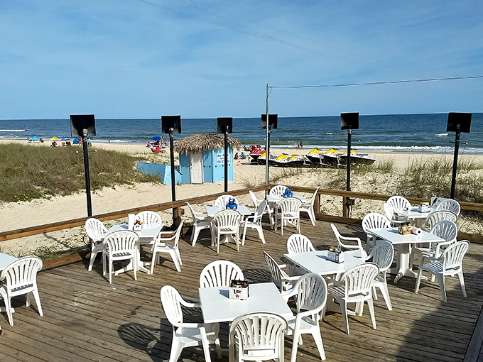 Beachfront tables offer the ultimate dining room where sand meets sky in perfect harmony.