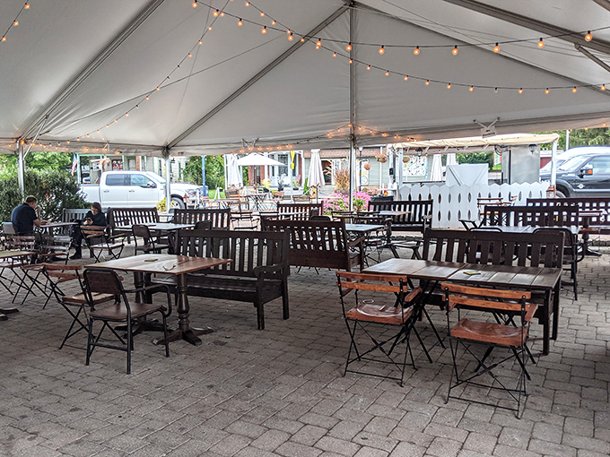 Outdoor dining under twinkling lights adds modern charm to historic surroundings. The perfect spot for summer evenings when history needs a breath of fresh air.