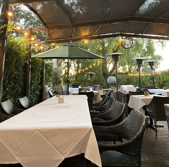 Outdoor dining under string lights transforms every meal into a magical evening under California stars. 