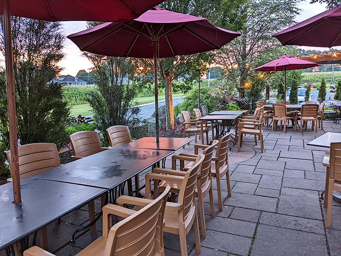 Outdoor seating that transforms ordinary meals into al fresco celebrations under burgundy umbrellas and Pennsylvania skies.