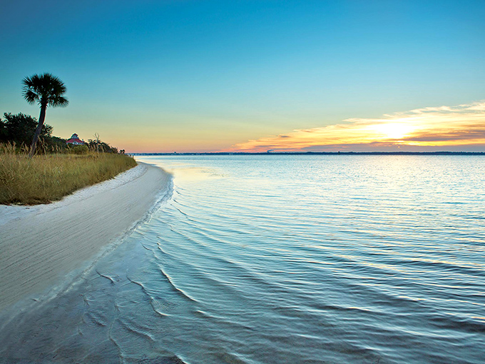 Sunset paints the shoreline in watercolor hues, proving that the best retirement entertainment remains absolutely free.