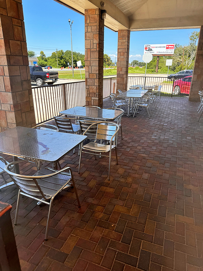 Al fresco dining, Florida-style. Those metal tables have witnessed countless conversations over pulled pork and sweet tea on balmy afternoons.