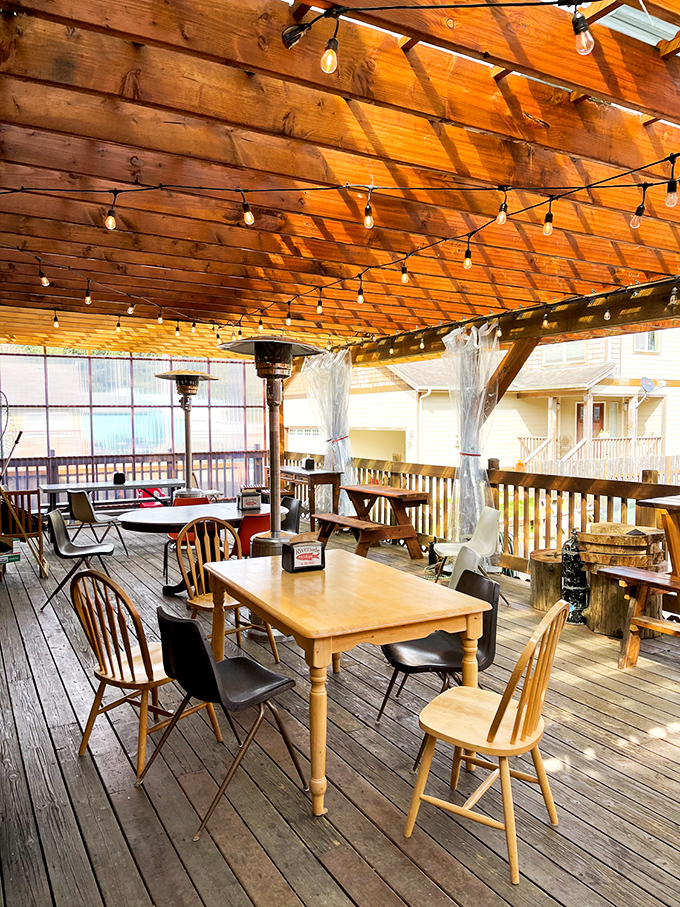 Wooden beams and string lights create an atmosphere somewhere between "rustic charm" and "I might never leave this deck."