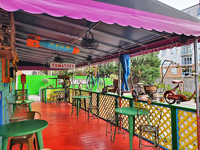 The outdoor patio brings the whimsy outside with vintage bicycles, bright colors, and a "TOMATOES" sign that's more declaration than information.