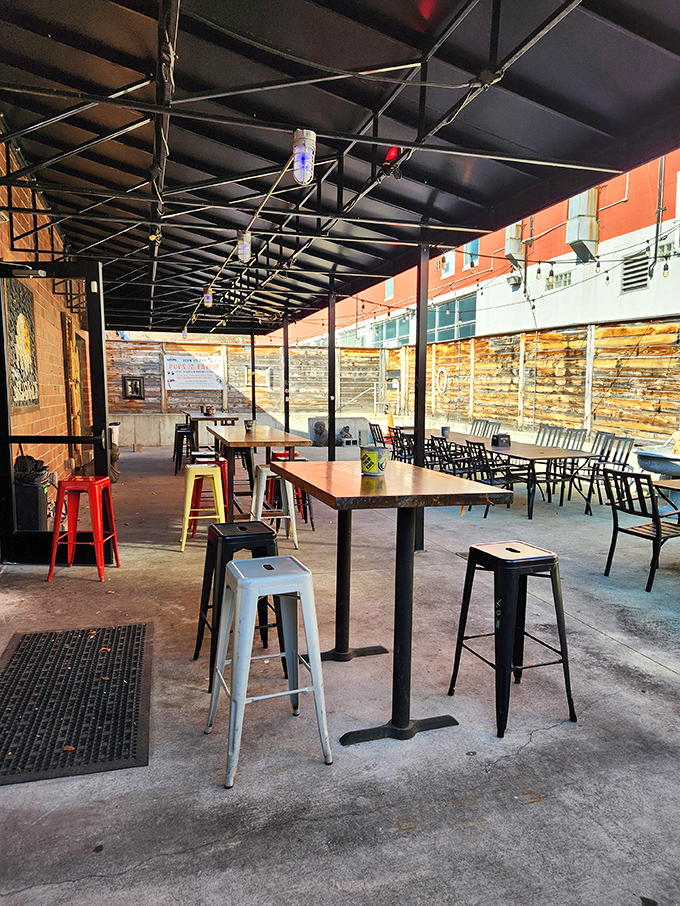 The patio offers urban al fresco dining with colorful stools that say, "Stay awhile, there's more pizza to be had."