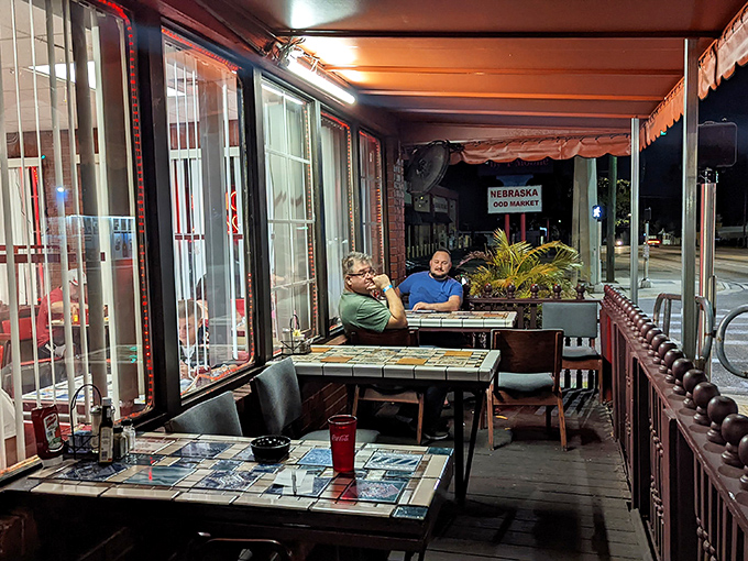 The covered patio offers al fresco dining with a side of people-watching &ndash; perfect for savoring both your meal and Nebraska Avenue's daily parade.