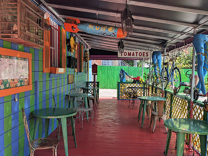 The patio continues the color explosion outdoors. Even the "TOMATOES" sign seems to be having more fun than at regular restaurants.