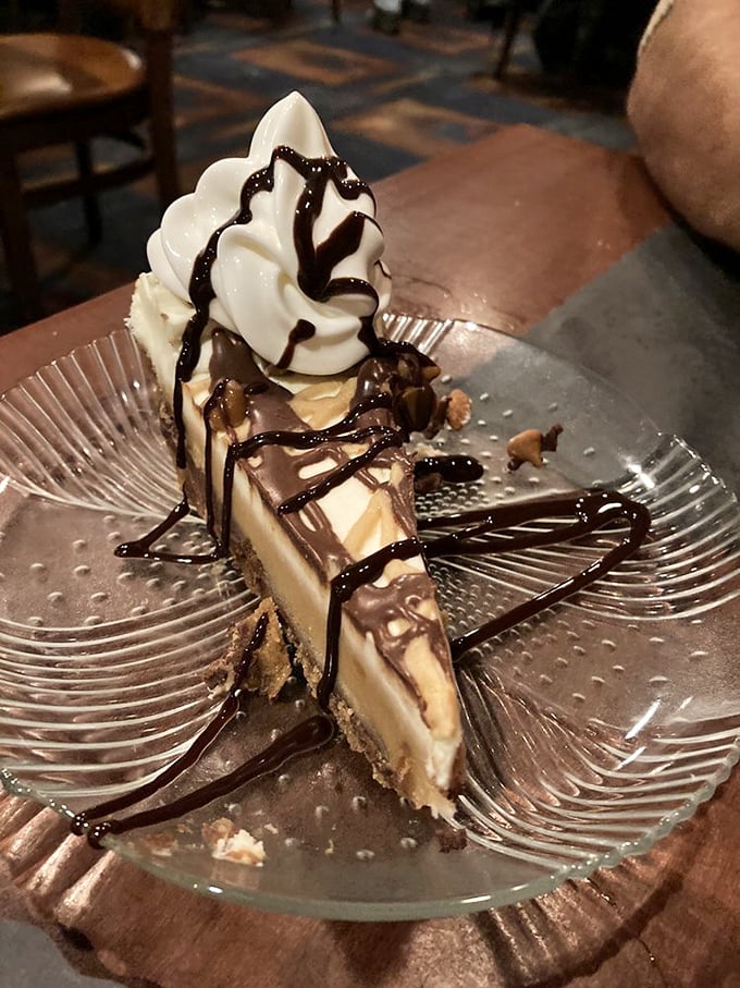 A slice of peanut butter pie that makes you wonder why anyone bothers with birthday cakes. That chocolate drizzle is writing love poems to your taste buds.
