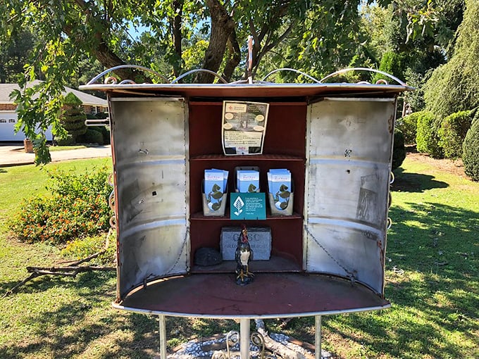 Even the information display becomes art here&mdash;housed in a repurposed metal container that complements the garden's blend of natural and industrial elements.