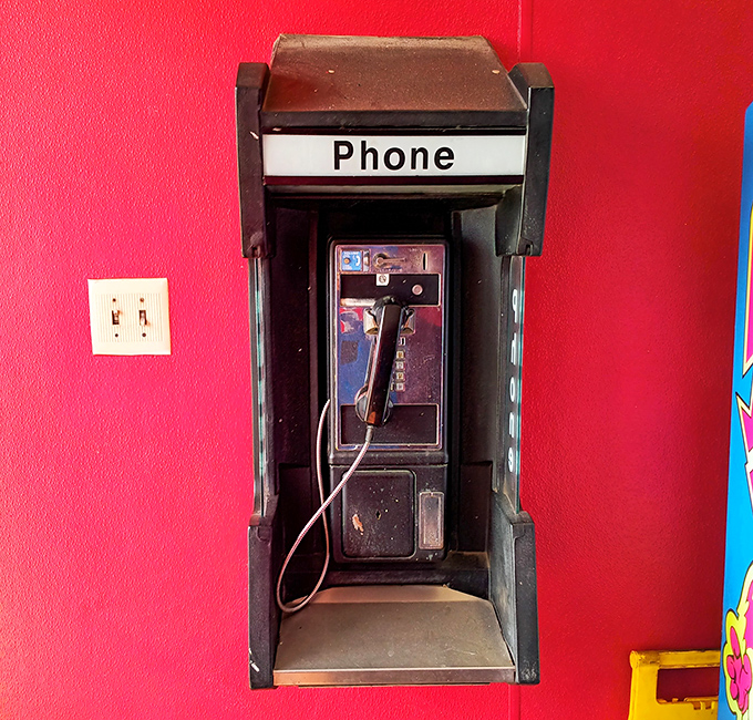 A real phone booth in 2024? This place respects tradition almost as much as their legendary barbecue recipes.