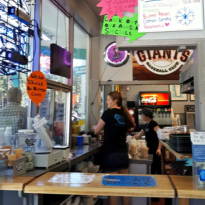 The moment of anticipation: where hungry patrons gather, united by the shared belief that something delicious awaits just beyond that window.