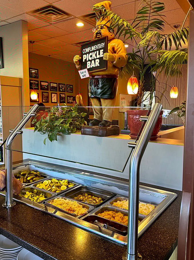 The complimentary pickle bar&mdash;a shrine to fermentation that deserves your respect and frequent visits. That chef statue stands guard over treasures both briny and sweet.