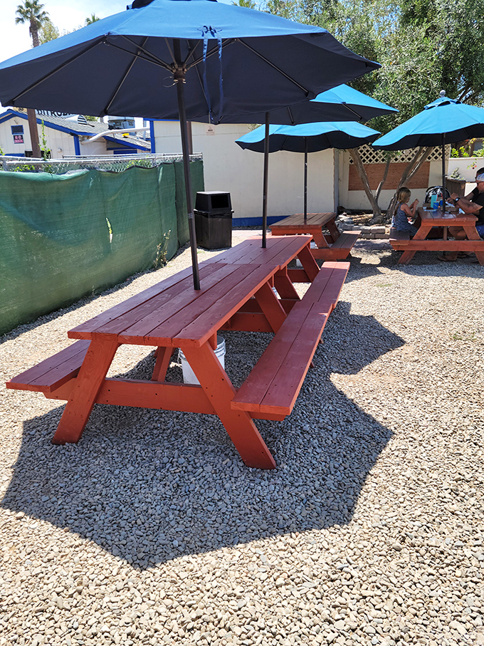 Picnic tables and blue umbrellas create the perfect stage for burger bliss&mdash;simple wooden platforms elevated to dining rooms with ocean-scented ambiance.
