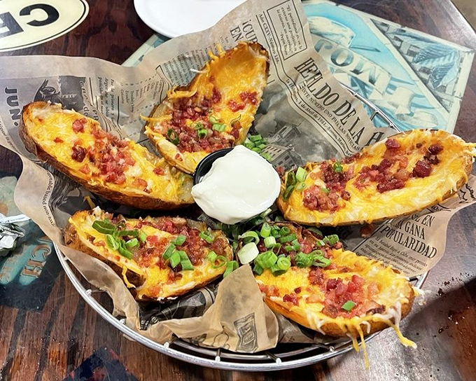 Potato skins loaded like treasure chests - each bite a crispy vessel carrying precious cargo of cheese and bacon.