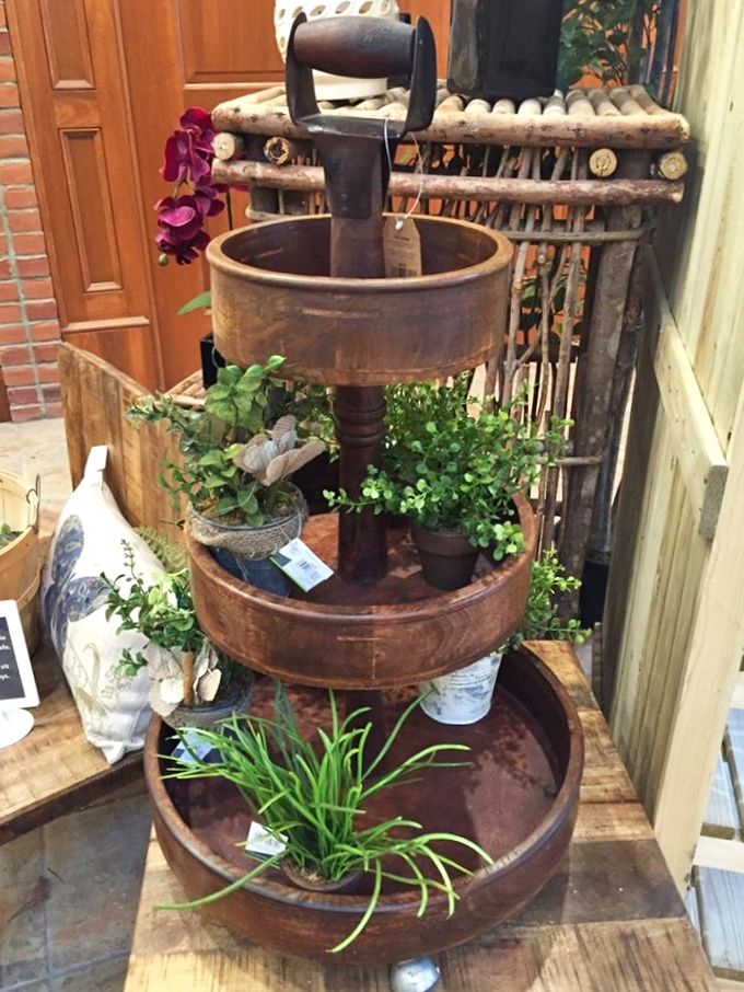 This three-tiered wooden display piece isn't just country chic&mdash;it's practically begging to become the conversation starter on your patio.