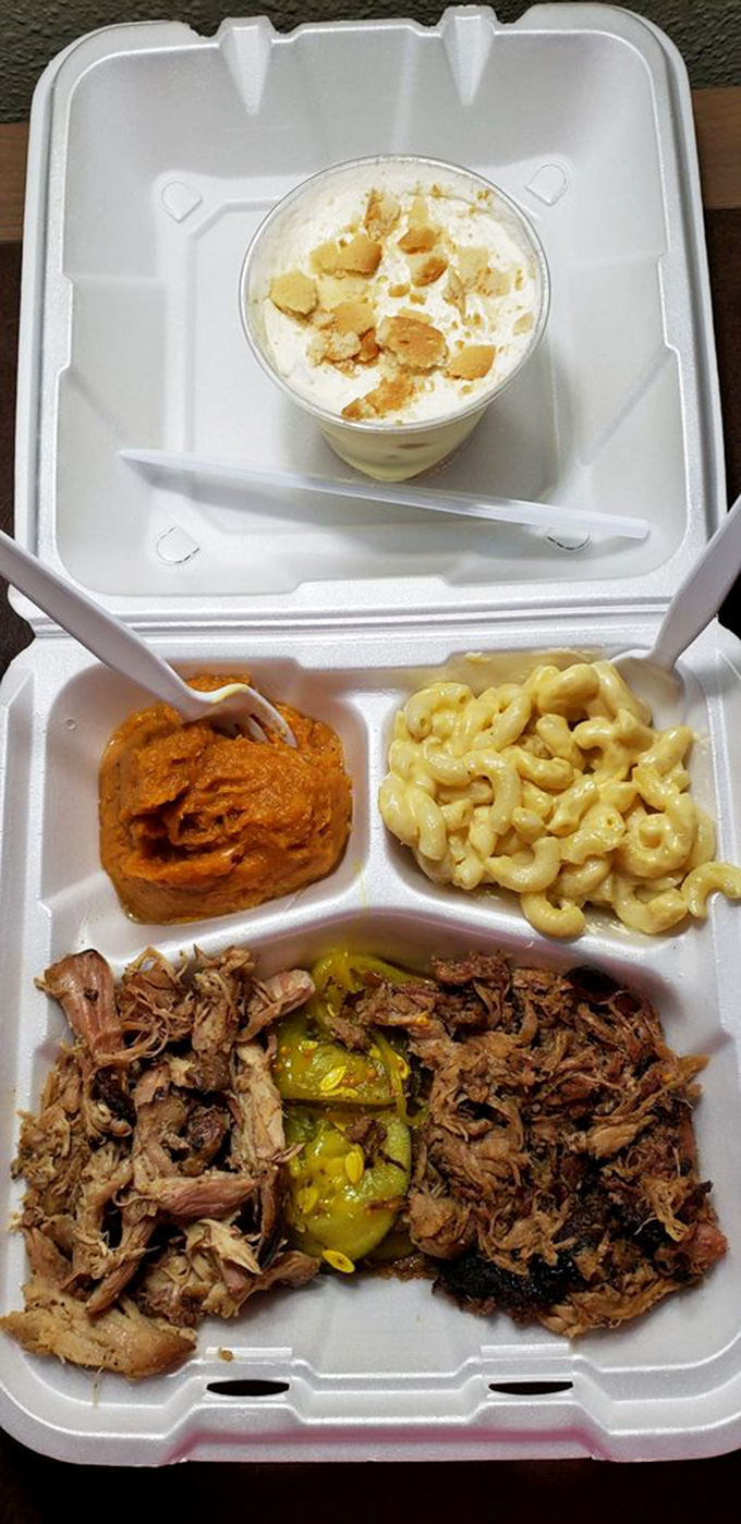 A takeout container of pulled pork, pulled chicken, mac and cheese, and sweet potato mash&mdash;basically, the four food groups of happiness.