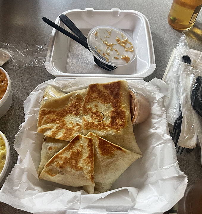 A quesadilla that's traveled south of the border and returned with a Tennessee accent. Perfectly grilled with what appears to be spicy chicken tucked inside.