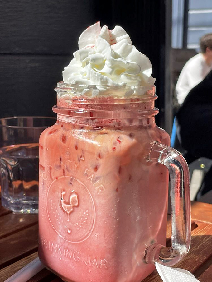 Red velvet latte combining dessert dreams with coffee necessity in one Instagram-worthy cup of joy.