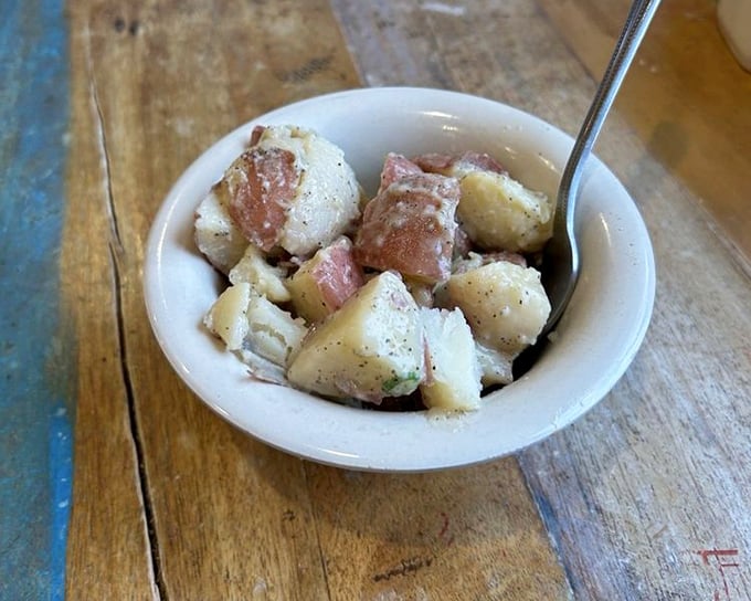 This isn't just potato salad; it's potato salad that went to culinary school. Simple ingredients transformed into something worth fighting over.