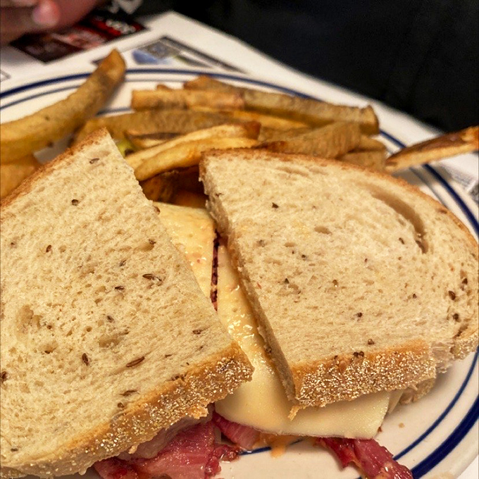 A sandwich that requires both hands and possibly a nap afterward, with fries that aren't just sides&mdash;they're co-stars deserving their own billing.
