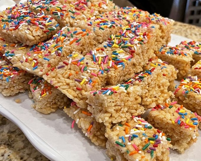 Rice Krispie treats topped with rainbow sprinkles prove that sometimes the simplest desserts bring the most childlike joy to grown-up buffet-goers.