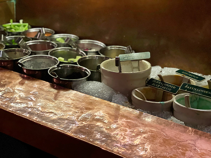 The salad bar's copper trim and perfectly chilled ingredients showcase the attention to detail that separates good restaurants from institutions.