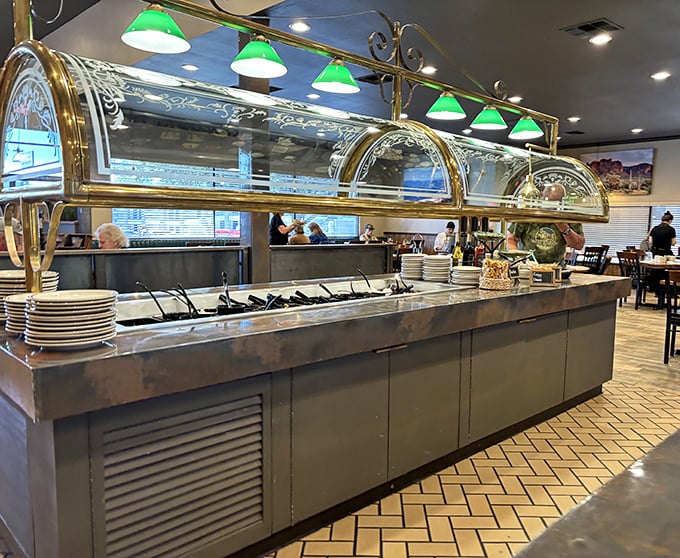 The salad bar gleams under green-shaded lights, offering fresh preludes to the main event. Even the vegetables dress up for dinner at Calico's.