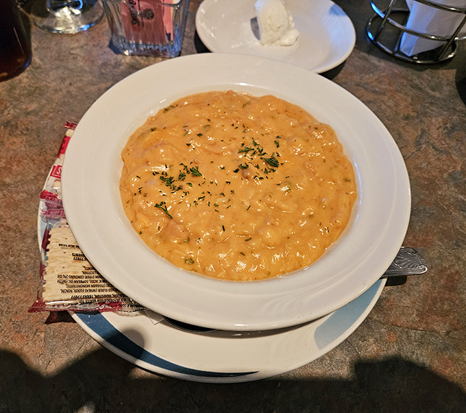 This creamy seafood bisque doesn't just sit in the bowl&mdash;it beckons, promising spoonfuls of oceanic comfort in every bite.