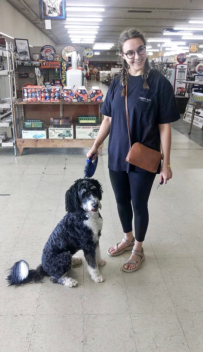 Even four-legged antiquers are welcome! This happy shopper and her pup prove vintage hunting is better with a furry companion.