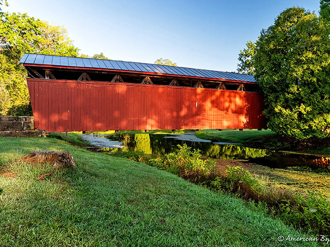 Golden hour transforms the bridge's weathered red siding into a warm glow that photographers chase and painters dream about capturing.