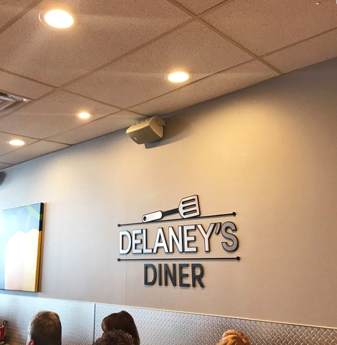 The wall art says it all—this is a place that takes breakfast seriously without taking itself too seriously.