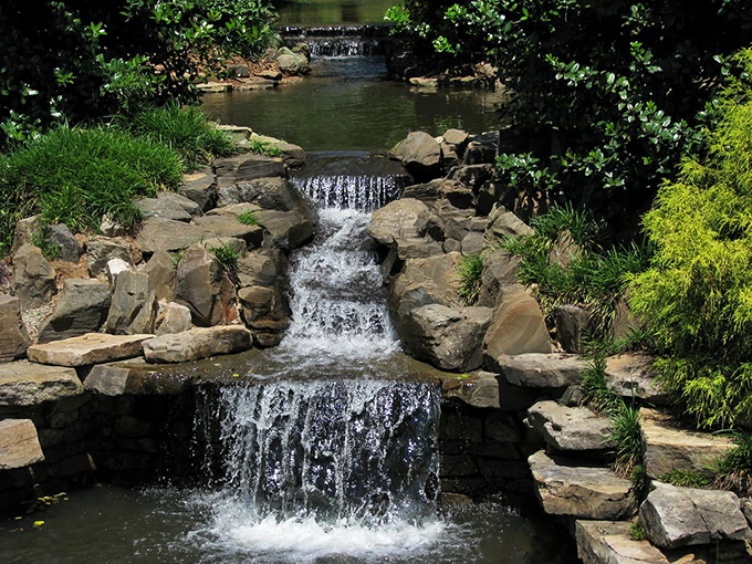 Water tumbles musically over carefully arranged stones. Nature's soundtrack perfectly complements the visual splendor surrounding you.