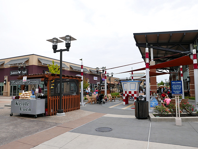 A kettle corn oasis amid shopping madness. These strategic rest areas save relationships when one partner has reached their shopping threshold.