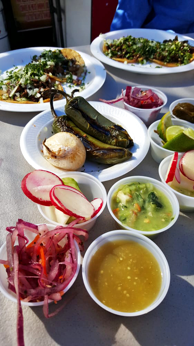 A feast fit for royalty served on humble paper plates. The roasted peppers alone would make a vegetarian consider conversion.