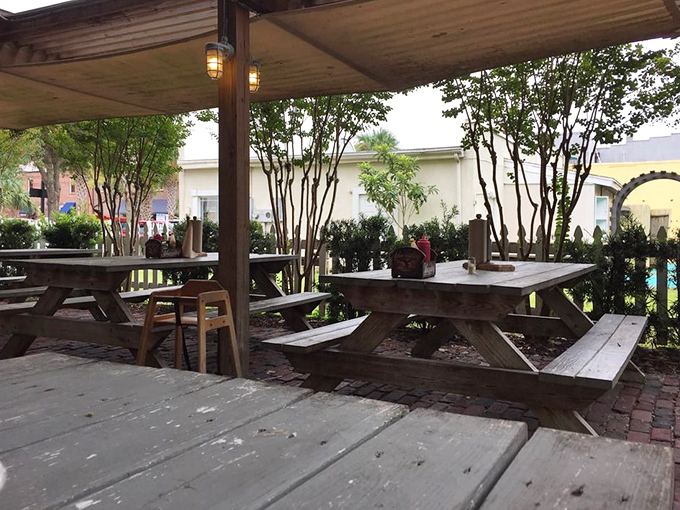 Picnic tables under wooden pergolas create that perfect "casual Florida afternoon" vibe—where time slows down and seafood tastes even better.