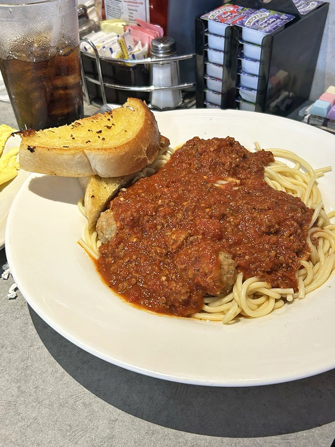 Spaghetti and meat sauce that doesn't pretend to be Italian – it's proudly diner-style comfort, served with buttery garlic toast.