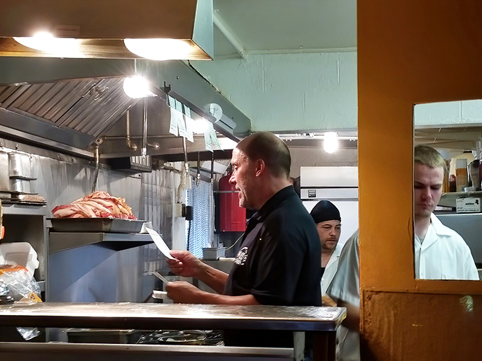 The kitchen commander in his natural habitat&mdash;where orders are shouted, bacon is sizzling, and breakfast perfection is just another Tuesday.