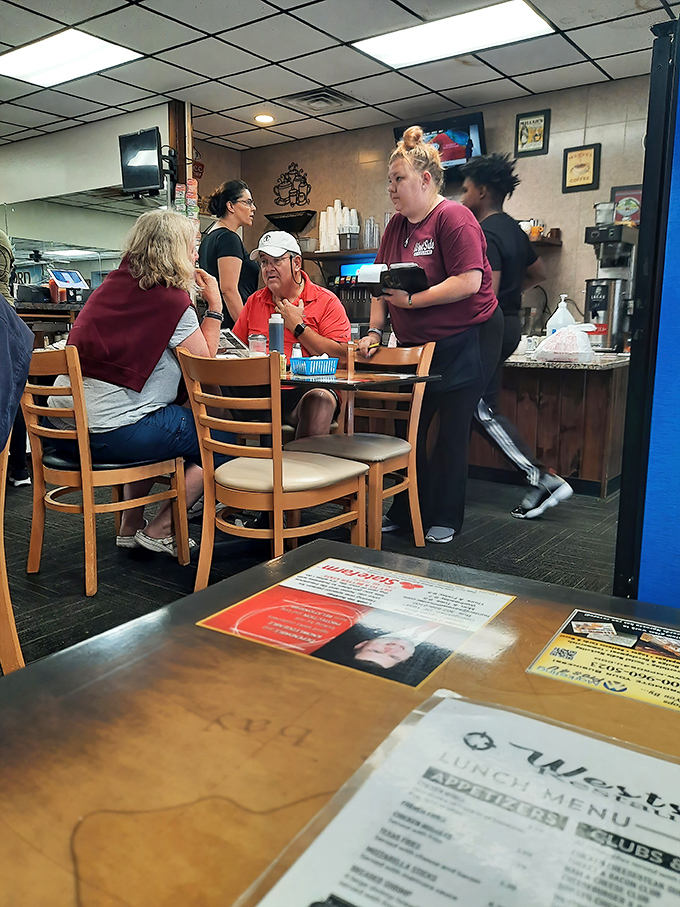 Where hospitality isn't corporate policy but genuine human connection. That server's attentive stance says everything about Westside's approach to customer care.