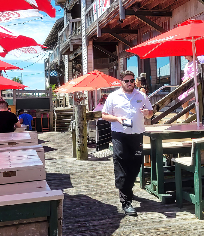 Service with Southern efficiency&mdash;staff navigate the bustling deck with the confidence of sailors who know these wooden boards like the back of their hands.