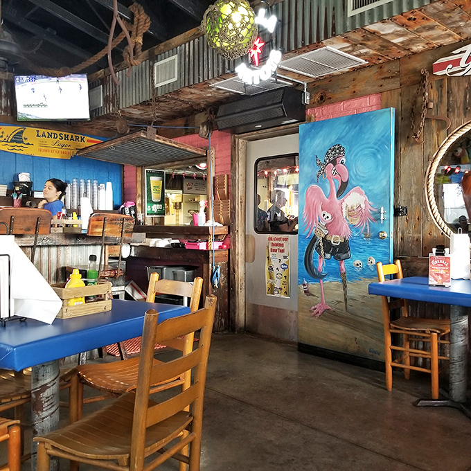 The rustic interior features whimsical flamingo art that reminds you this place doesn't take itself seriously&mdash;just its seafood.