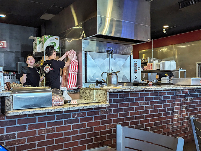 The staff moves with practiced efficiency, transforming raw ingredients into BBQ gold. These are the alchemists who turn patience into flavor.